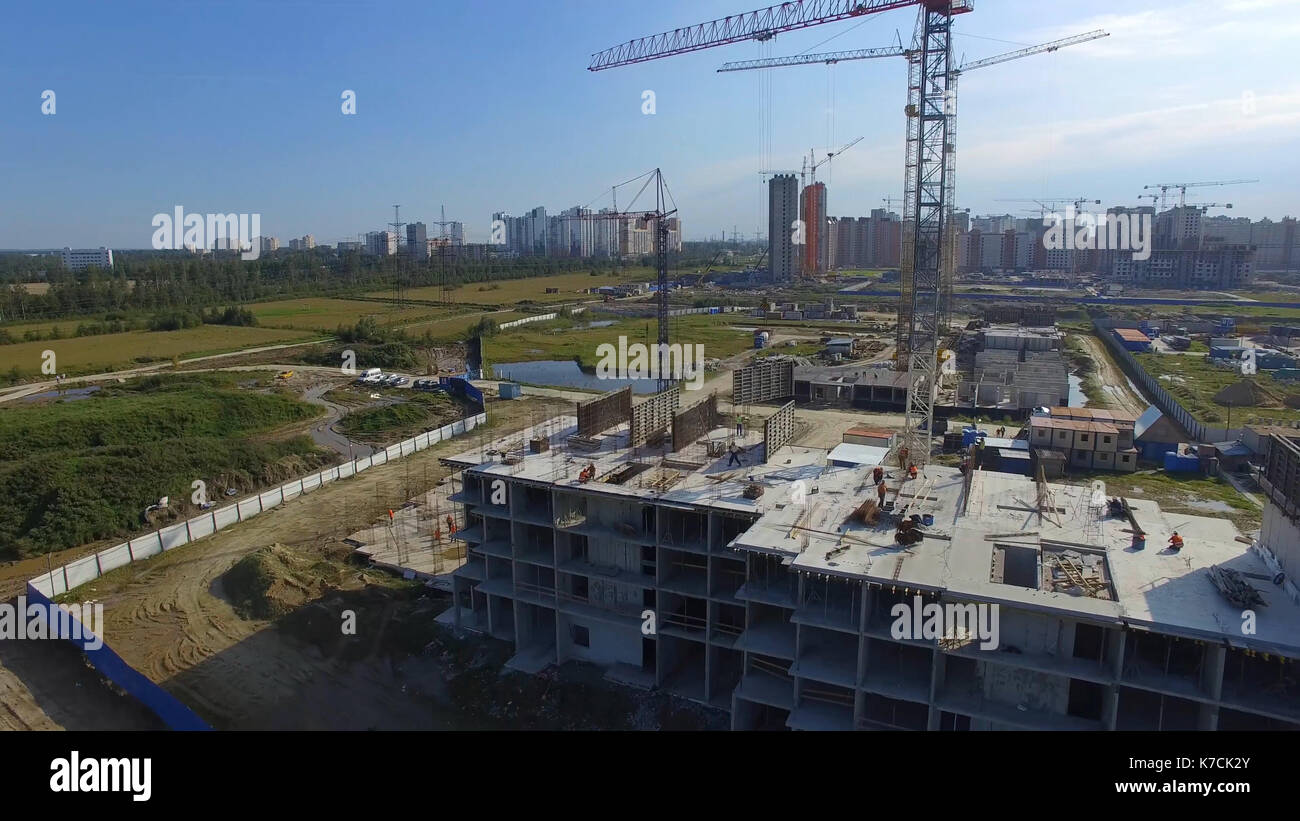 Aerial view on construction building. Construction site workers, aerial ...