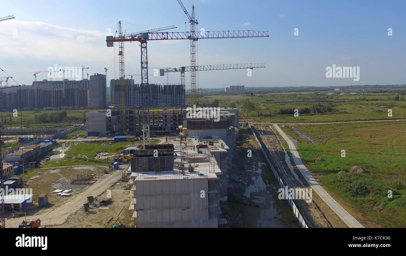 Aerial view on construction building. Construction site workers, aerial ...
