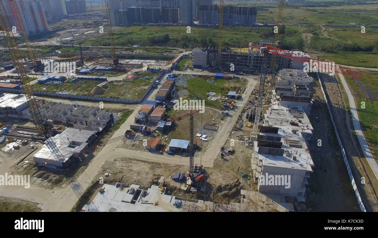 Aerial view on construction building. Construction site workers, aerial ...