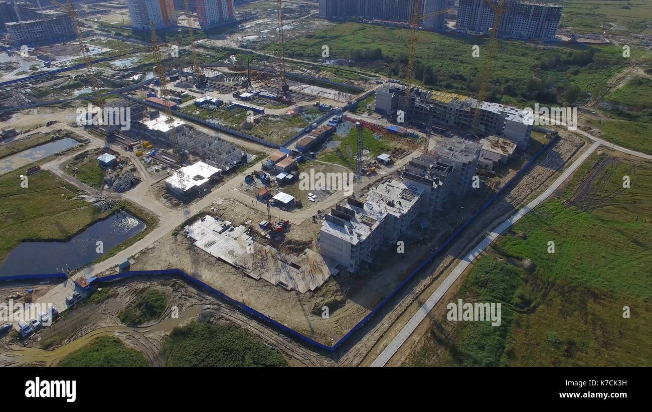 Aerial view on construction building. Construction site workers, aerial ...