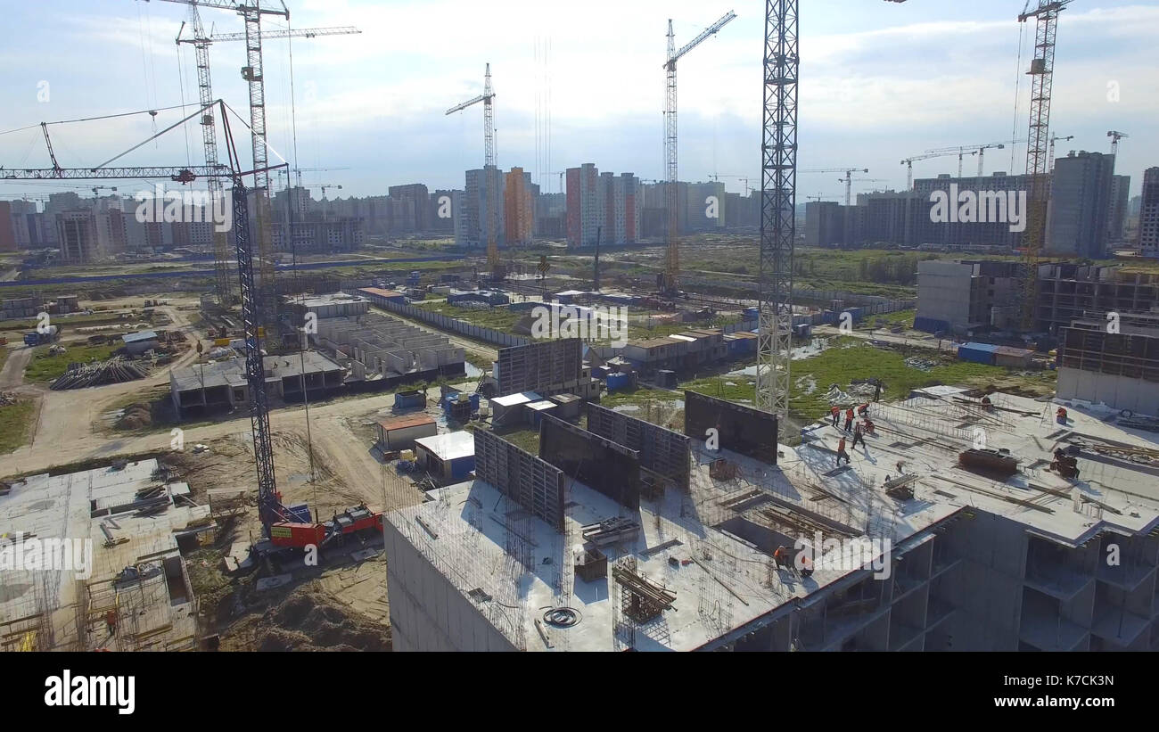 Aerial view on construction building. Construction site workers, aerial ...