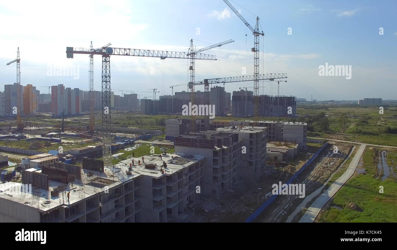 Aerial view on construction building. Construction site workers, aerial ...