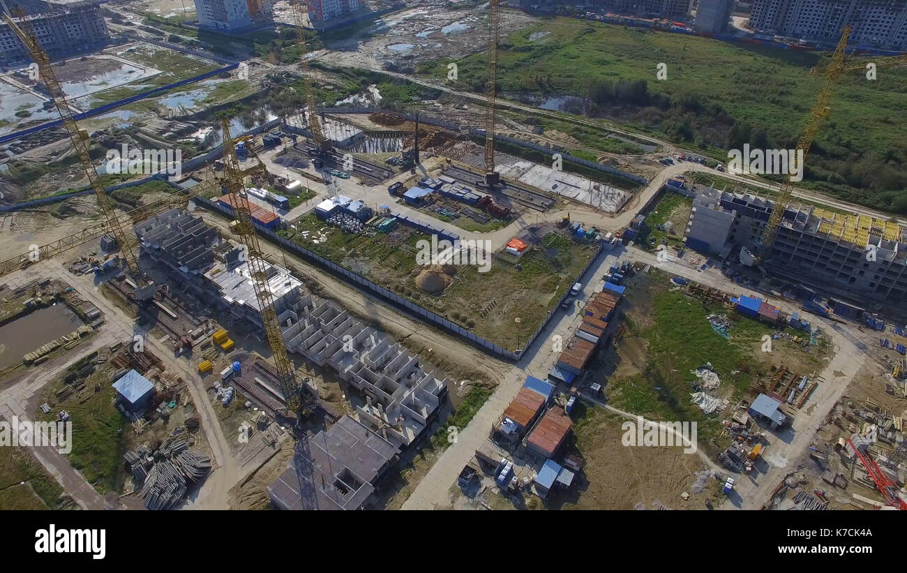 Aerial view on construction building. Construction site workers, aerial ...