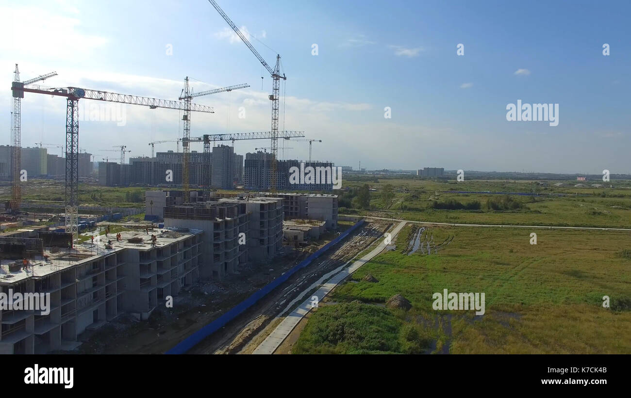 Aerial view on construction building. Construction site workers, aerial ...