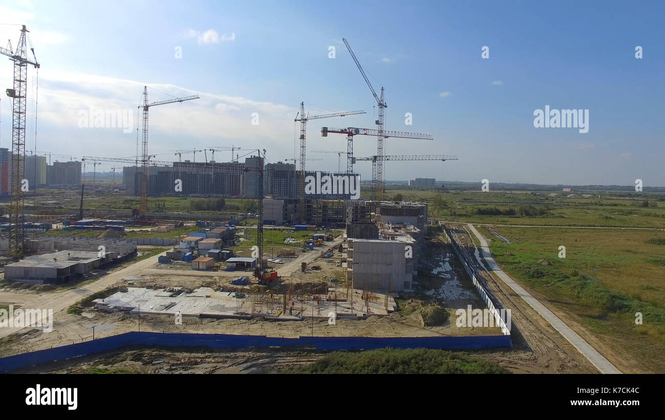 Aerial view on construction building. Construction site workers, aerial ...