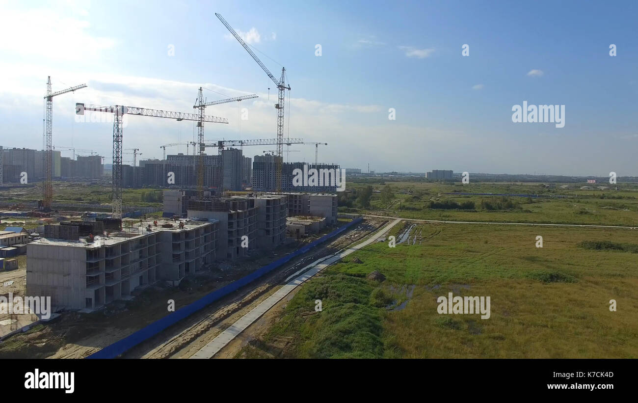 Aerial view on construction building. Construction site workers, aerial ...