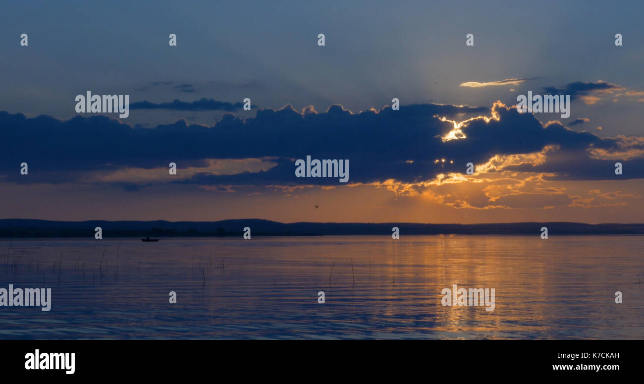 beautiful sunset over of a lake Stock Photo - Alamy