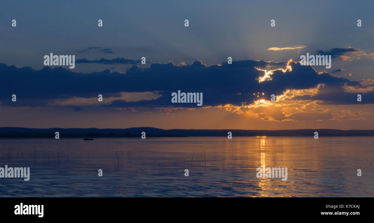 beautiful sunset over of a lake Stock Photo - Alamy