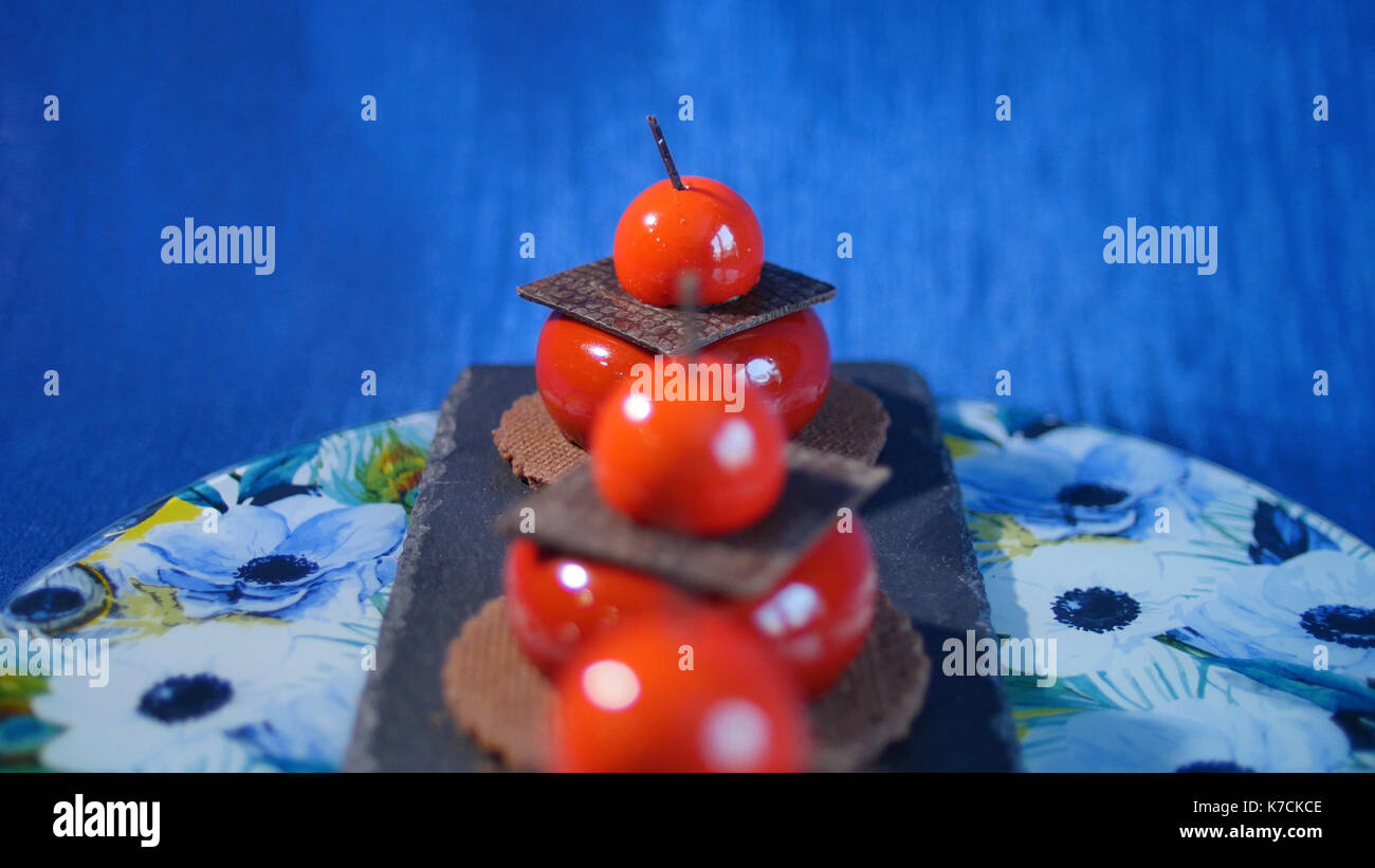 Three red cake with biscuits and chocolate. Tasty red cakes on ...