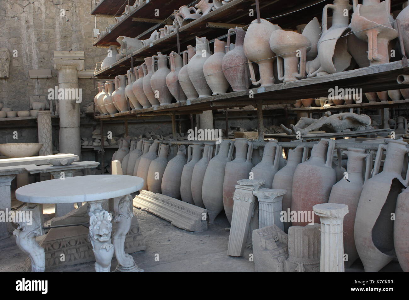 Pompei, Italy, August 9 2014: Pompei roman amphoras and petrified body ...