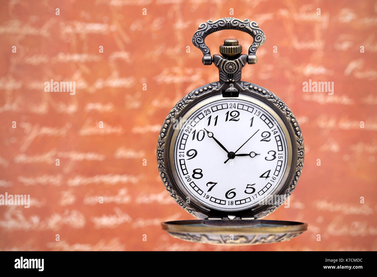antique pocket watch on old letter background Stock Photo - Alamy