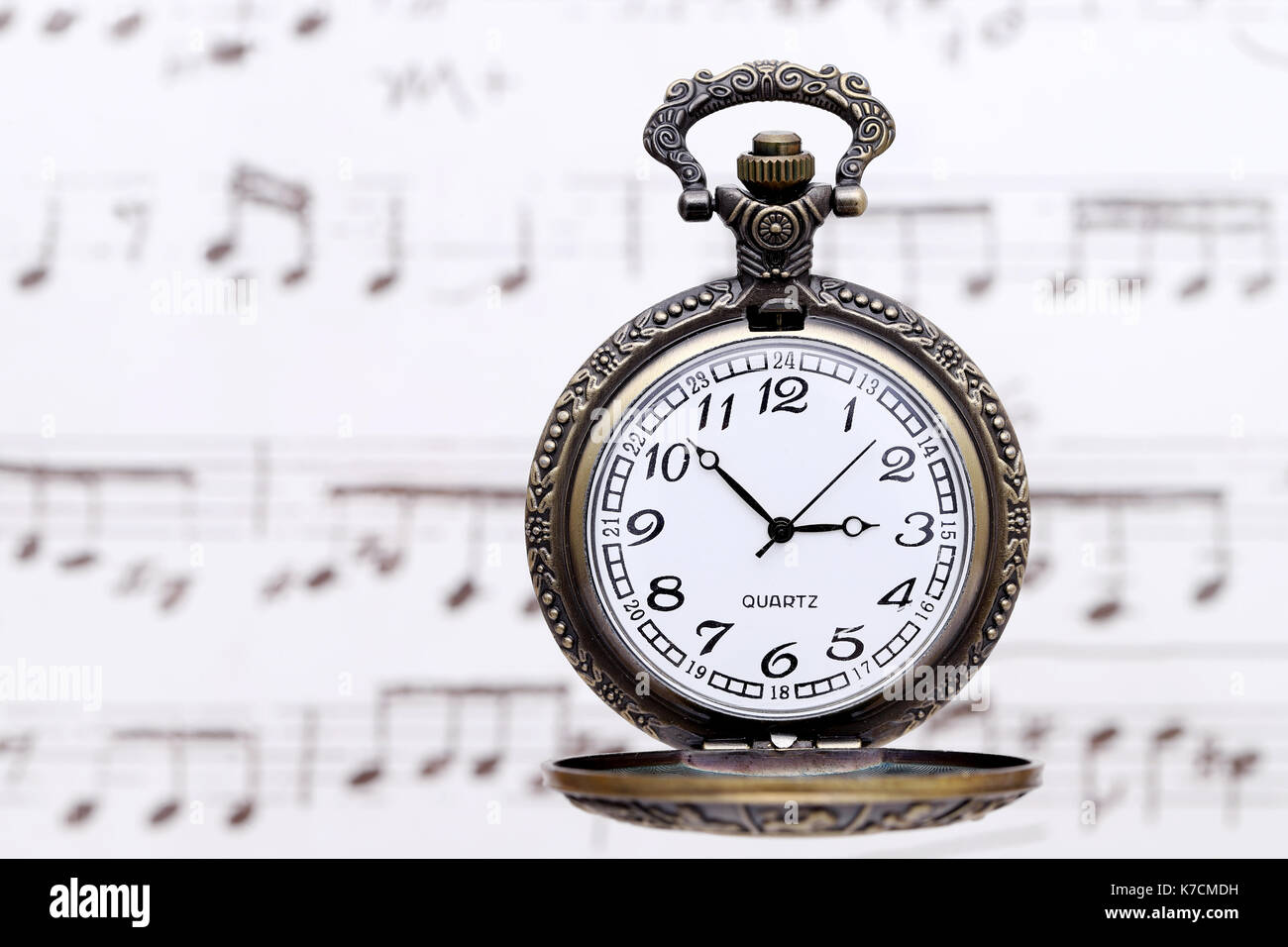 antique pocket watch on old manuscript background Stock Photo - Alamy