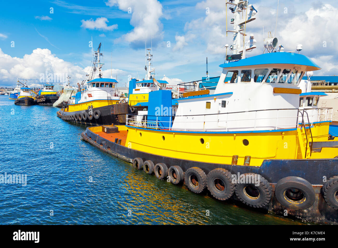 Colorful tugboats lined up in the Seattle Ship Canal Stock Photo - Alamy