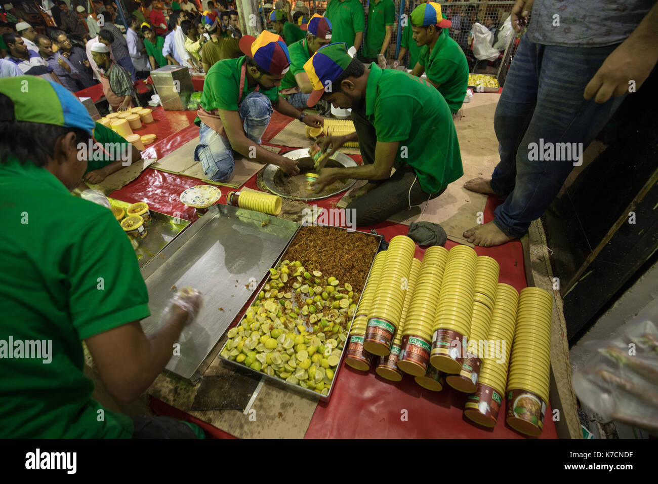 Staff packing Haleem in plastic containers for sale in Hyderabad,India ...