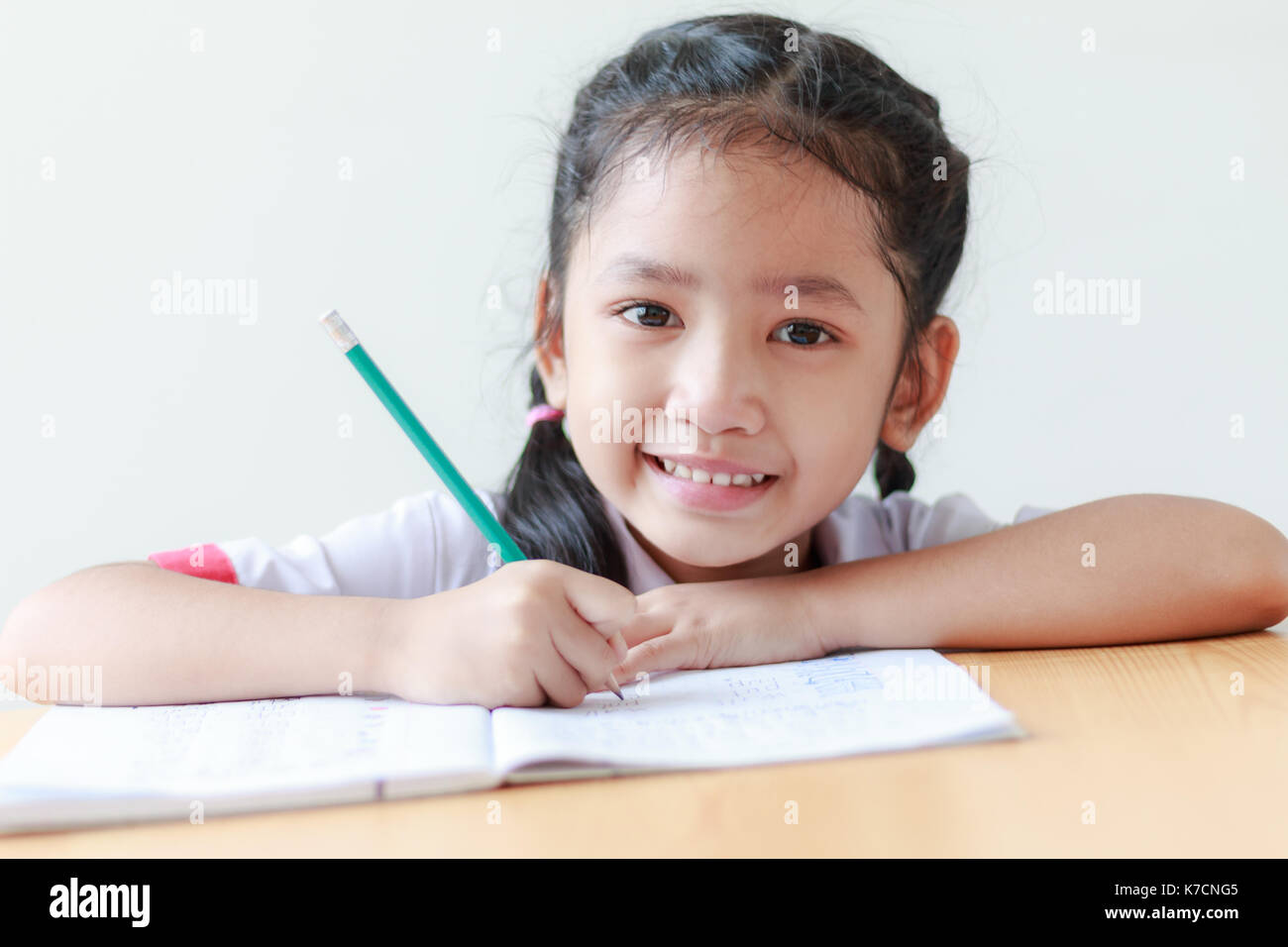 Portrait of Asian little girl in Thai kindergarten student uniform ...