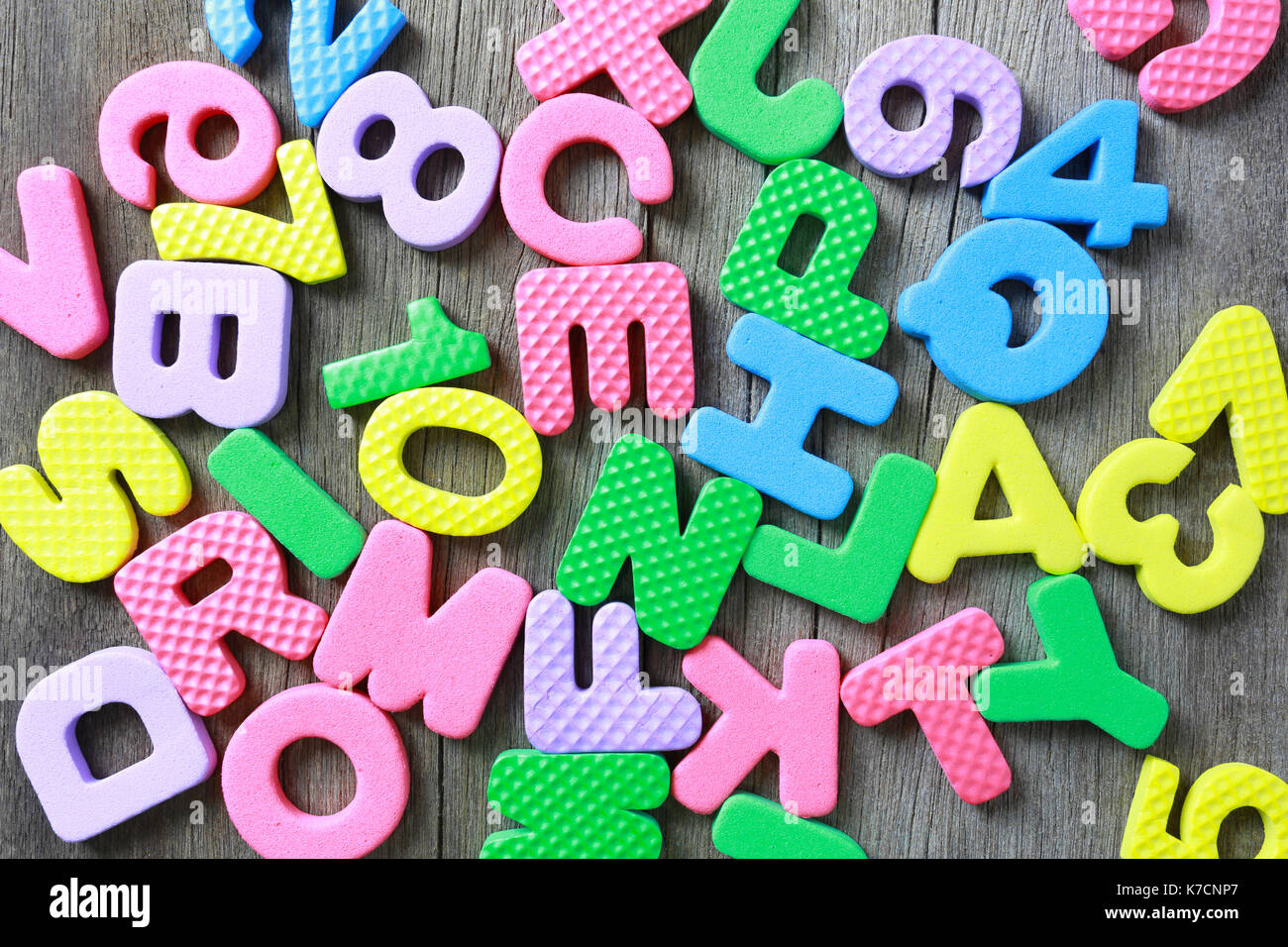 alphabet text invention lay on old brown wood for design in your work ...