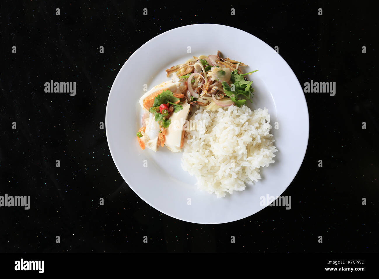 Salted eggs and fish salads eat with jasmine rice on white dish,spicy ...