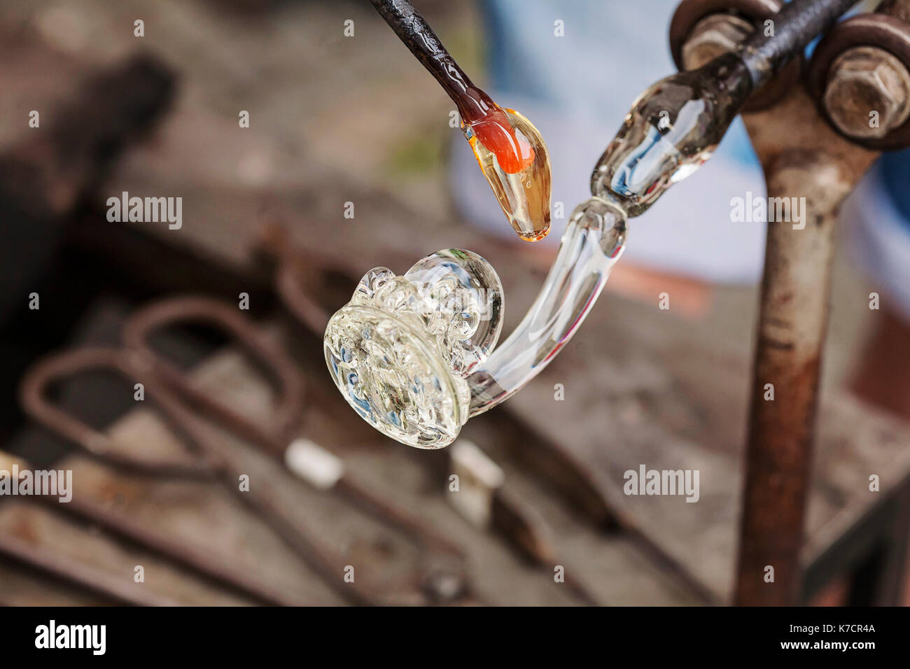 Glass artist making new piece of glass art in the furnace Stock Photo ...