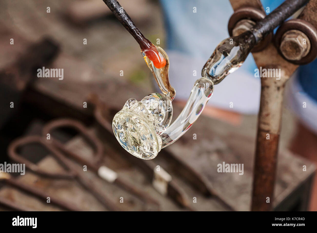 Glass artist making new piece of glass art in the furnace Stock Photo ...