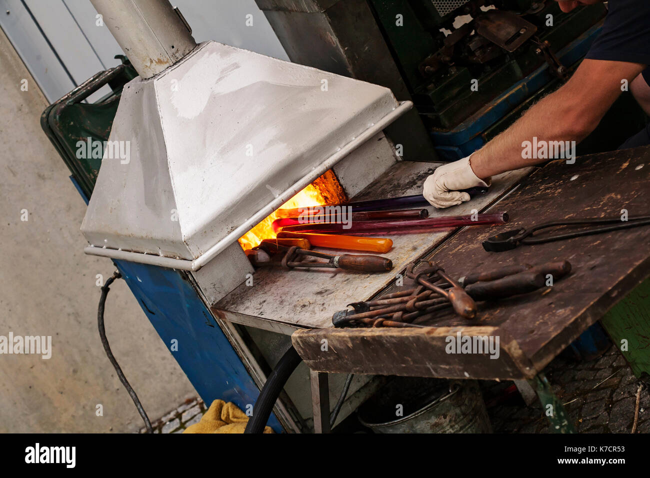 Glass artist making new piece of glass art in the furnace Stock Photo ...