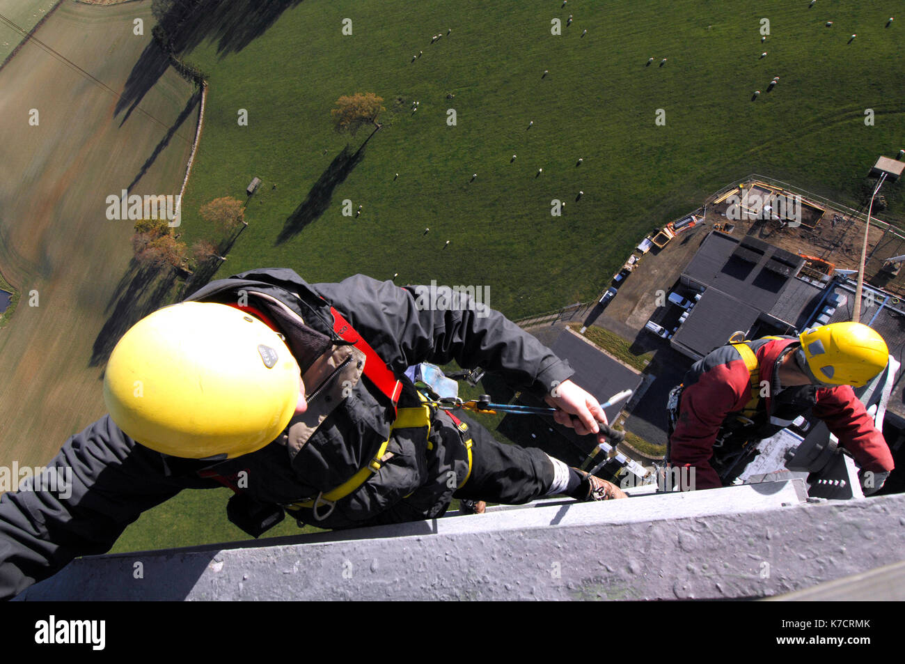 Aerial riggers and engineers working on a telecoms telecommunications ...