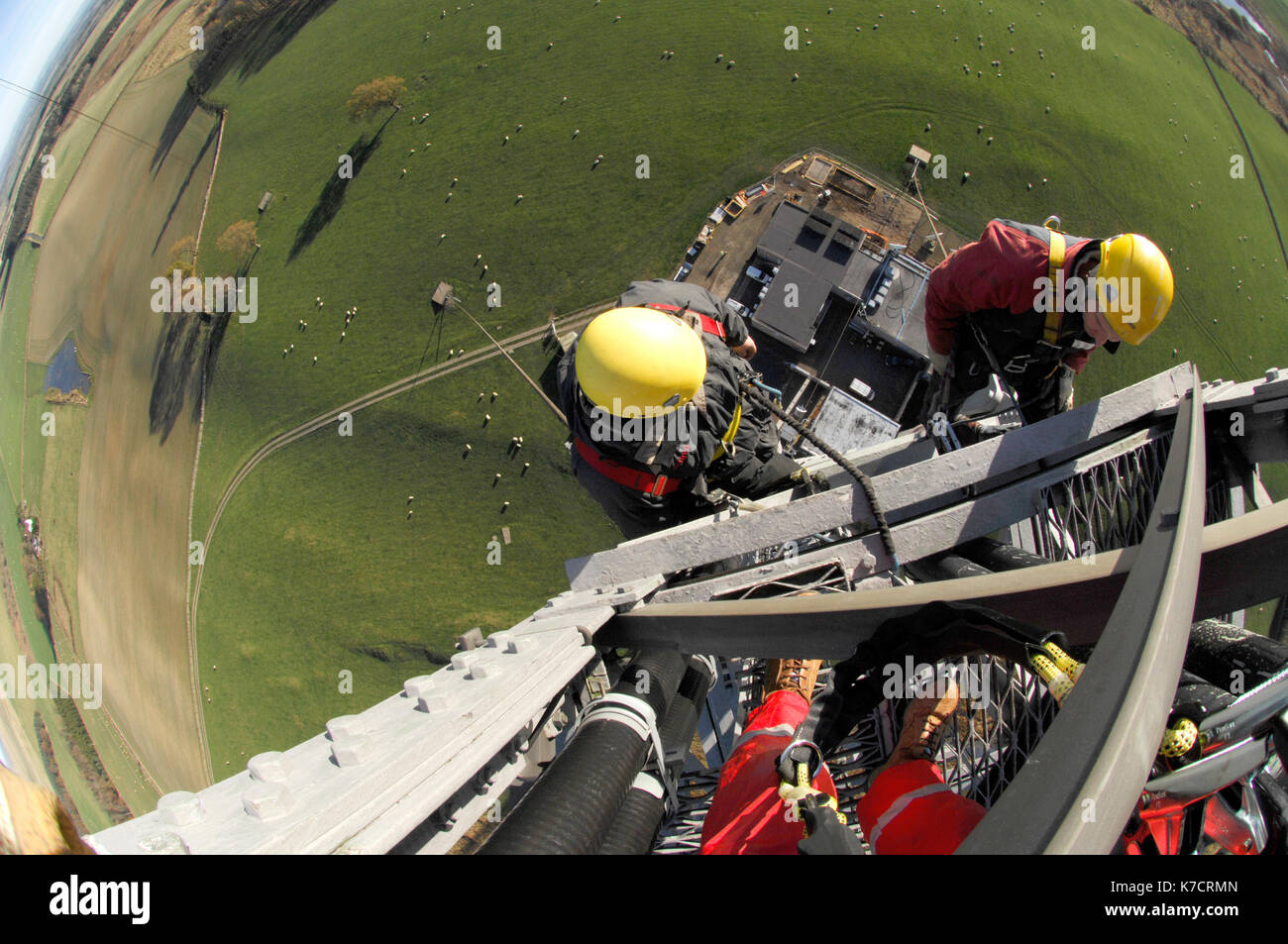 Aerial riggers and engineers working on a telecoms telecommunications ...