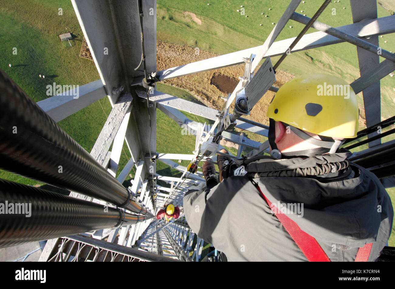 Aerial riggers and engineers working on a telecoms telecommunications ...