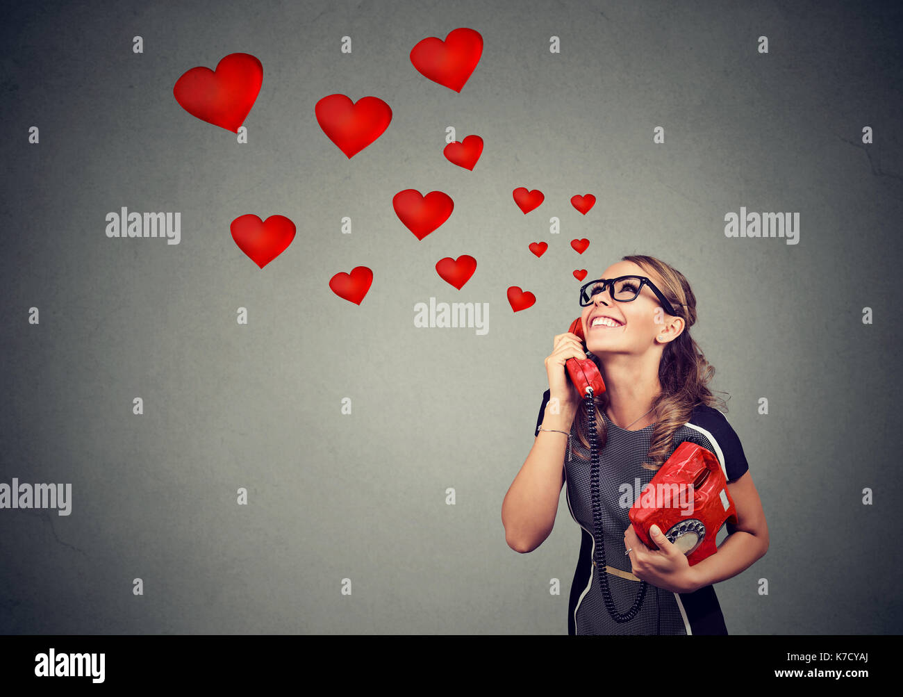 Smiling beautiful woman in love talking on the phone Stock Photo - Alamy