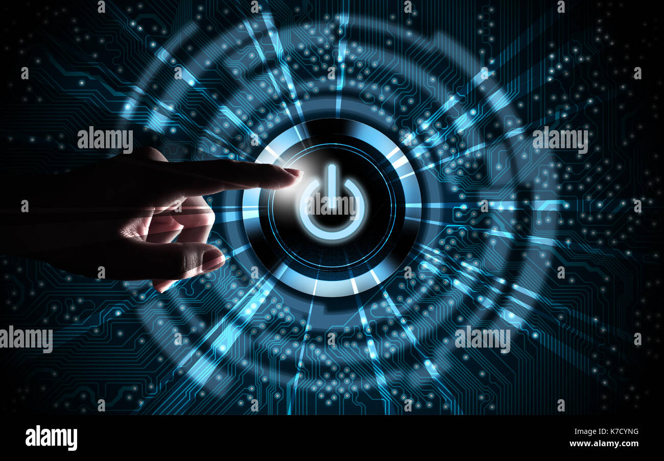 Hand pressing power button on blue digital background Stock Photo - Alamy