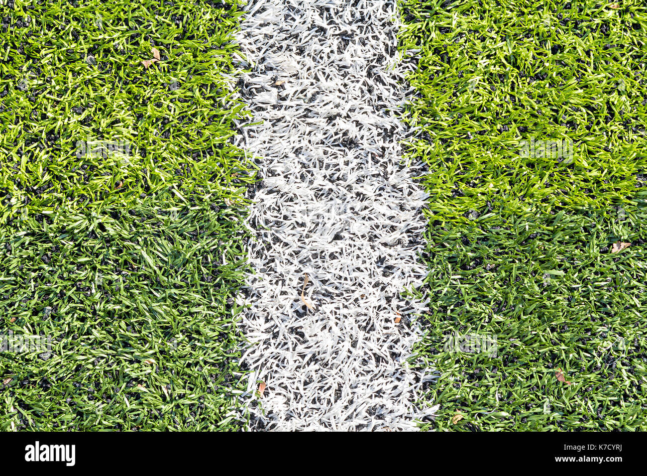 Artificial turf with white marking line Stock Photo - Alamy