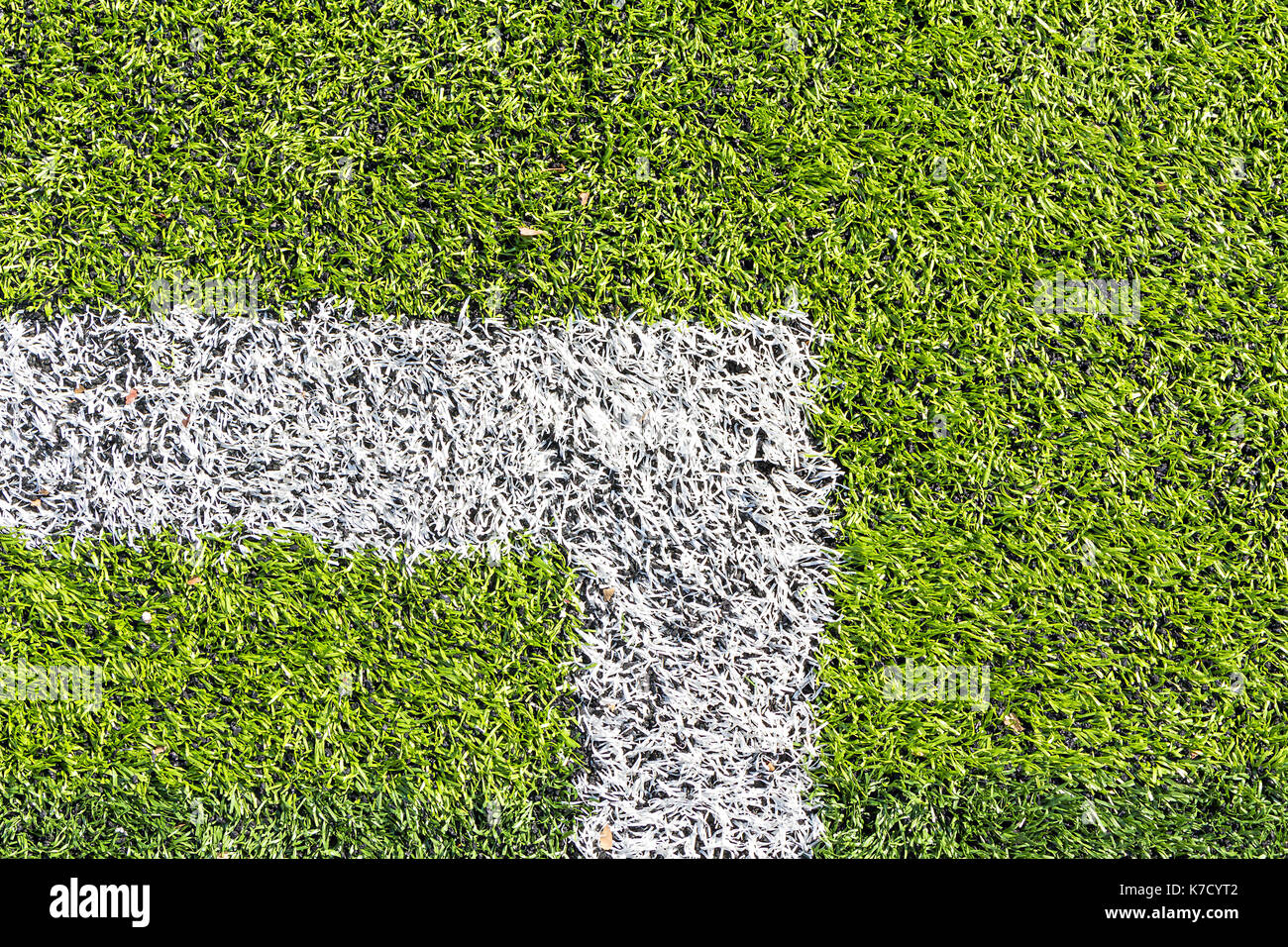 Artificial turf with white marking line Stock Photo - Alamy