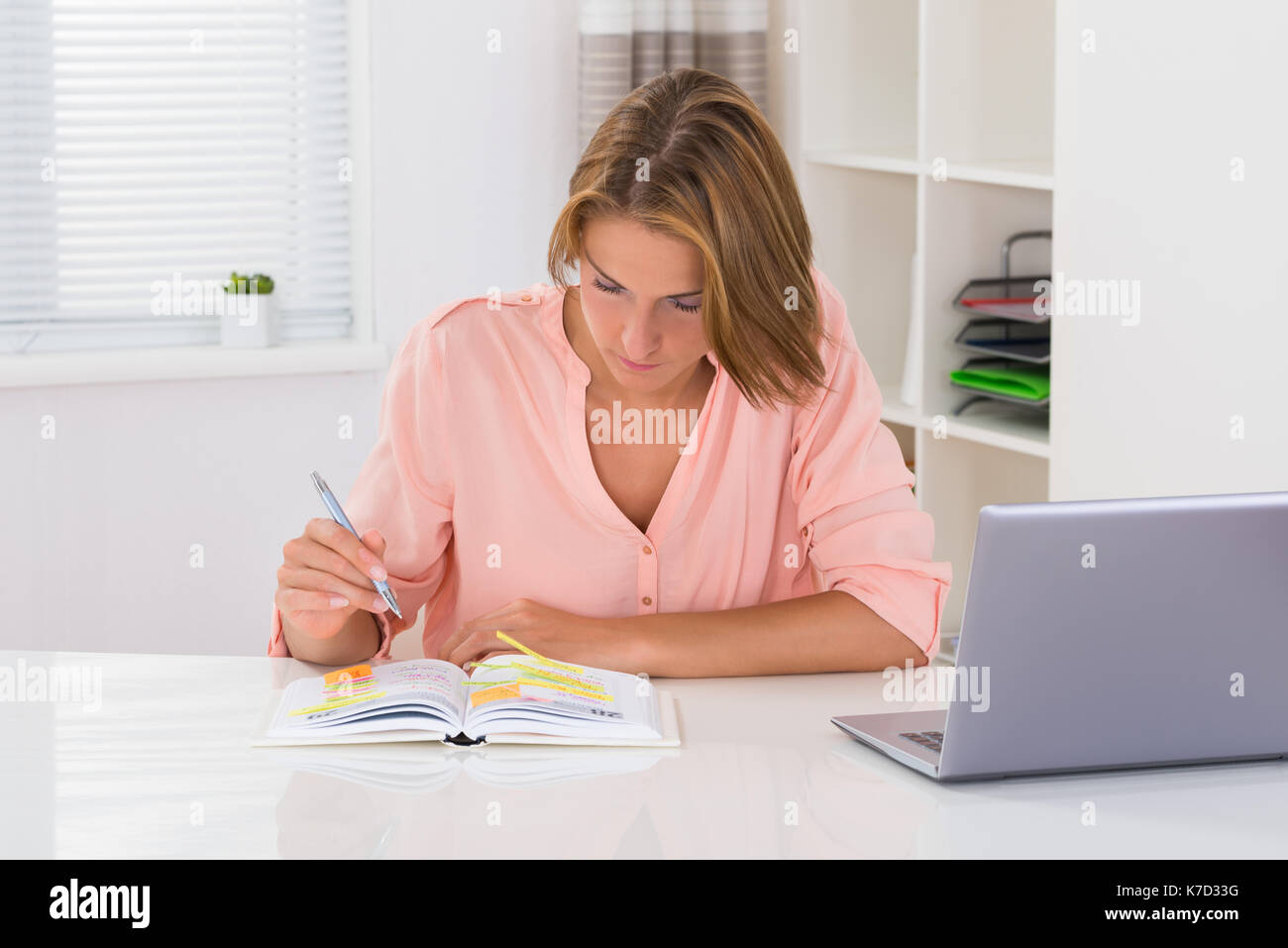 Female writing in diary hi-res stock photography and images - Alamy