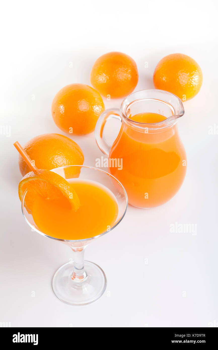 Glass jar and glass with orange juice Stock Photo - Alamy