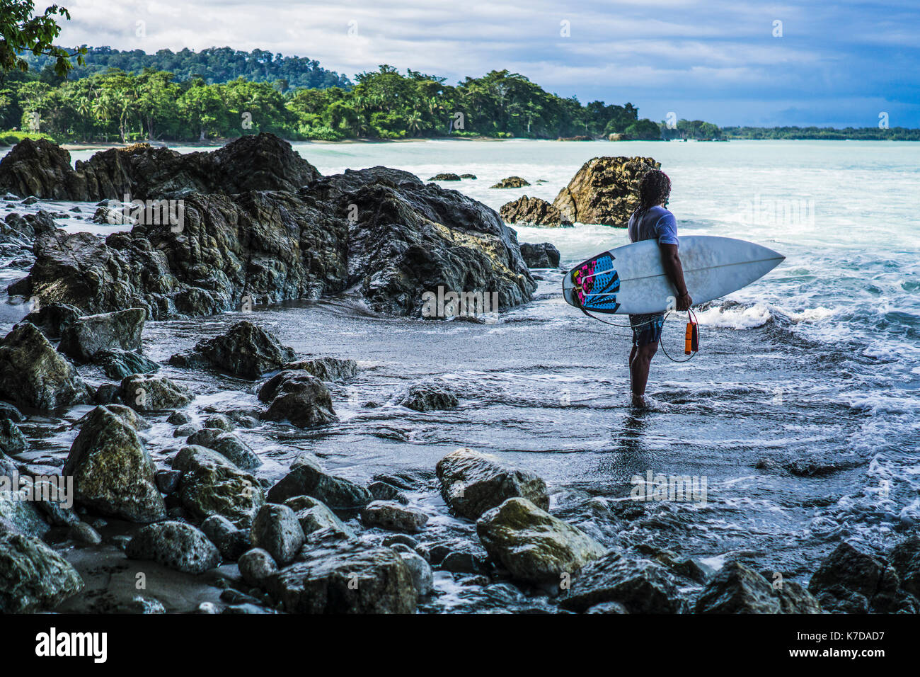 Male surfer standing surfboard beach hi-res stock photography and ...