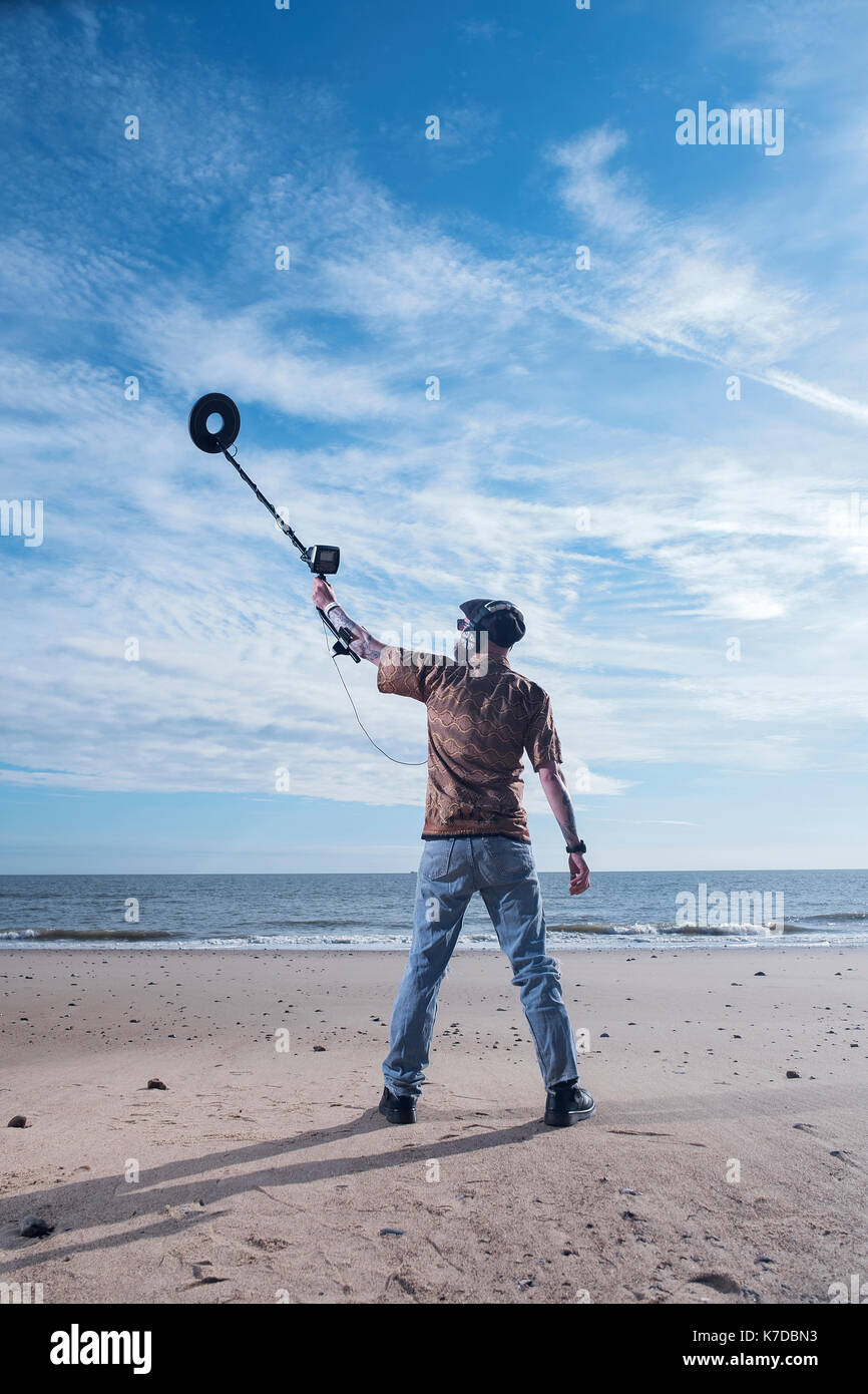 Man holding metal detector hi-res stock photography and images - Alamy