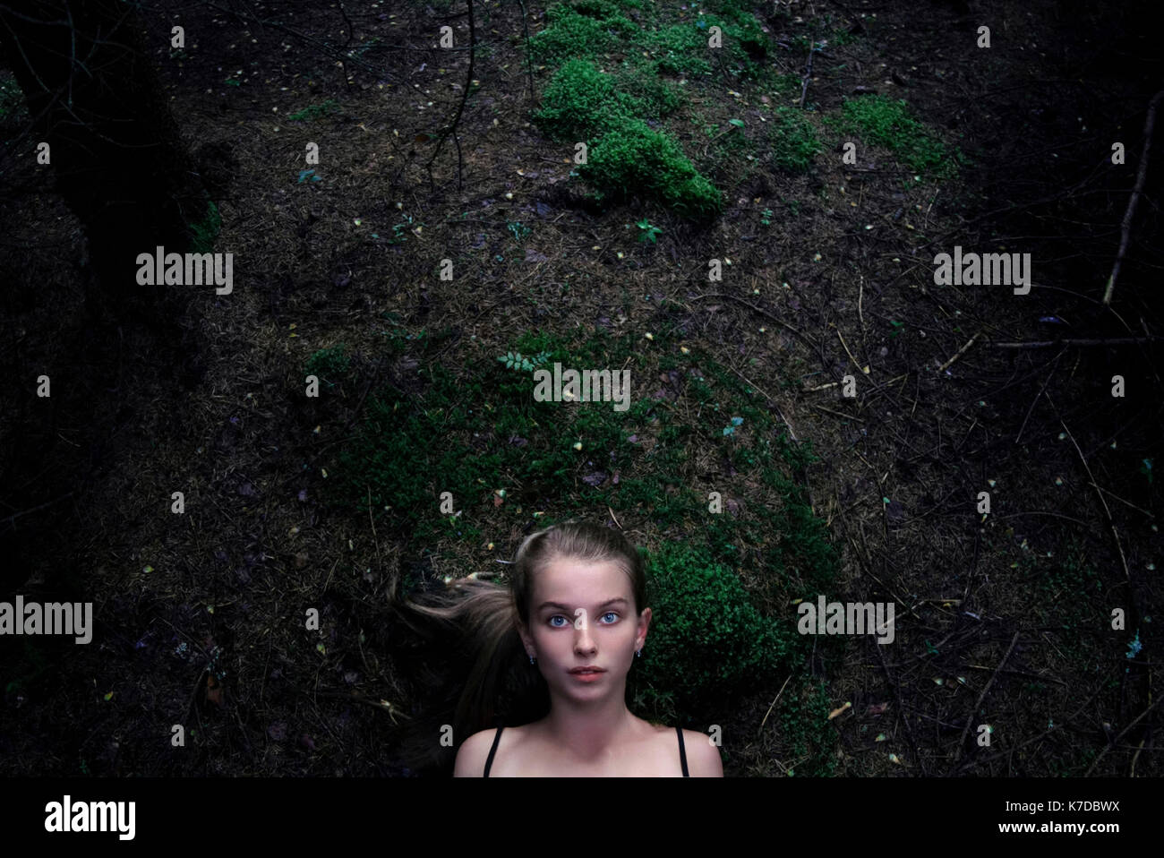 Overhead portrait of woman lying at garden Stock Photo - Alamy