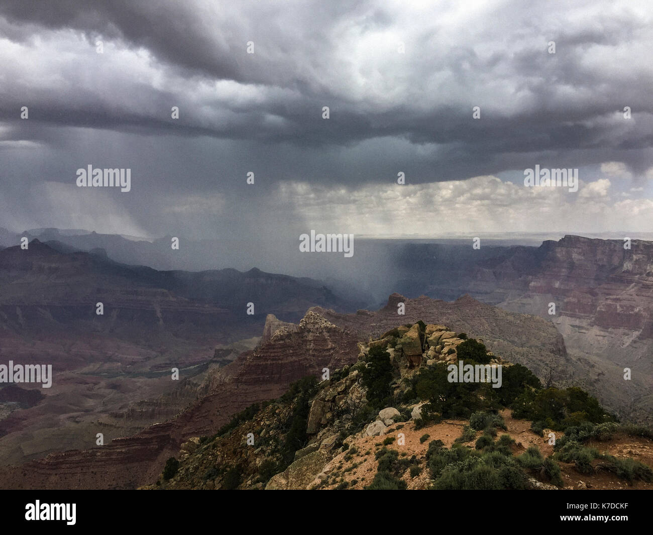 Storm clouds raining over Grand Canyon Stock Photo - Alamy
