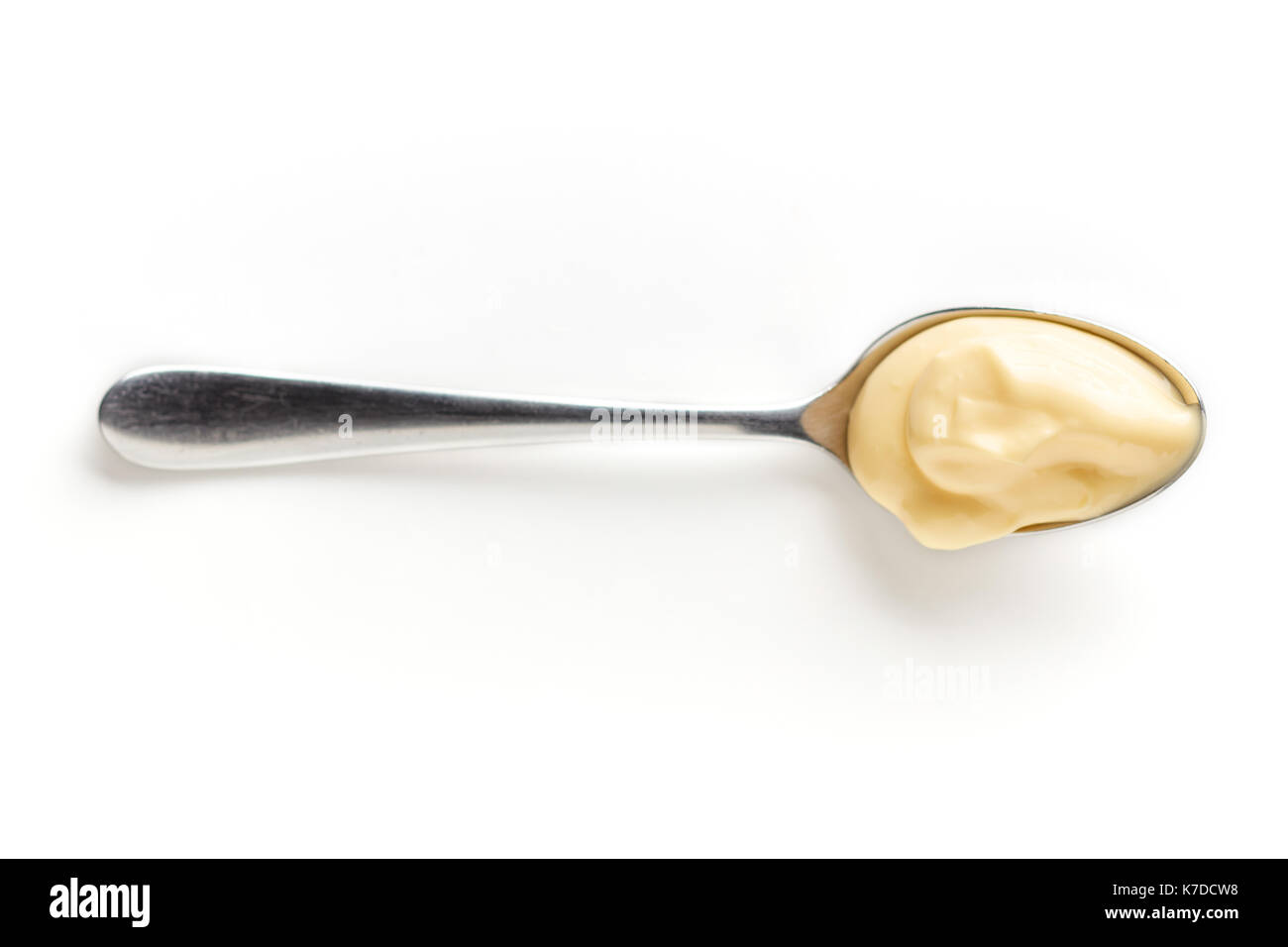 Mayonnaise in a spoon, isolated on white background, top view Stock ...
