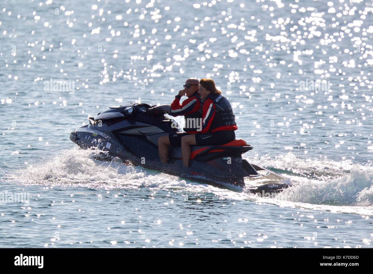 A couple having fun on a jet ski Stock Photo - Alamy