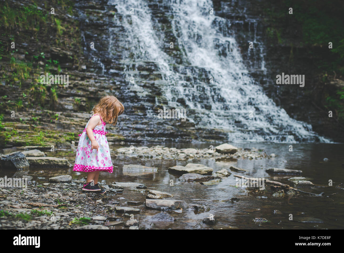 Girl Standing At Waterfall High Resolution Stock Photography and Images ...