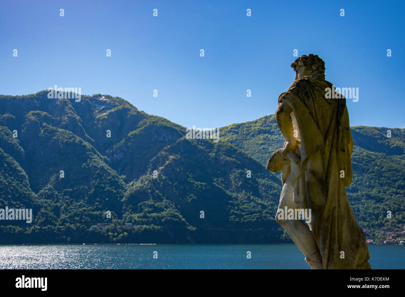 Scenic view of statue by Lake Como against clear sky Stock Photo - Alamy