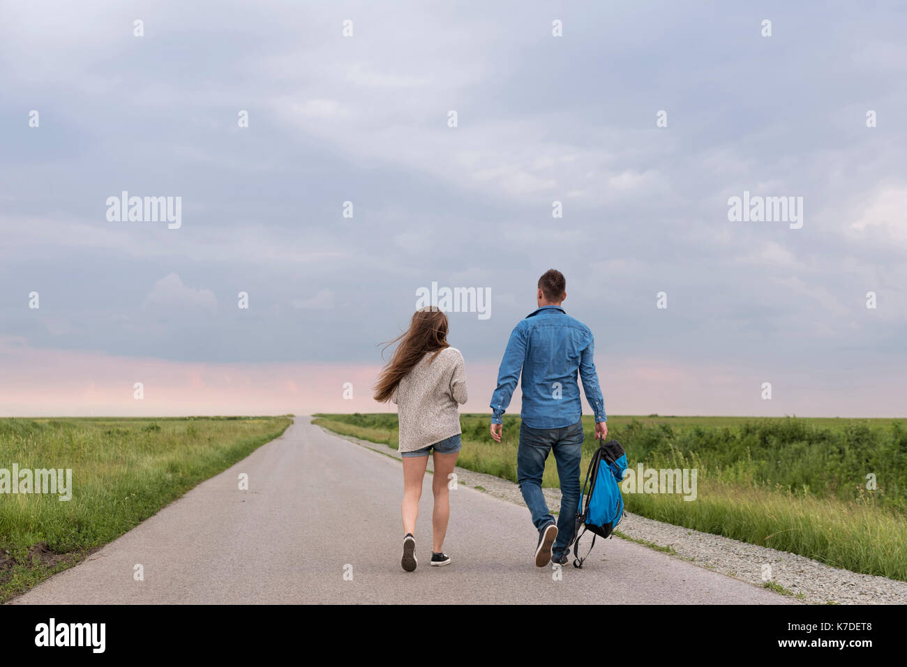 Field country couple walking hi-res stock photography and images - Alamy