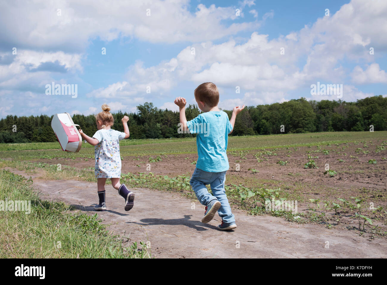 Rear view brother sister walking hi-res stock photography and images ...