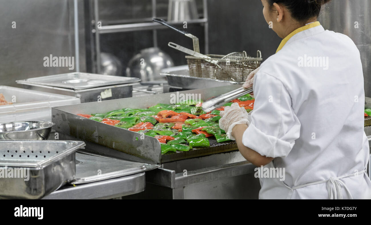 Busy cooks and workers in a commercial kitchen Stock Photo - Alamy