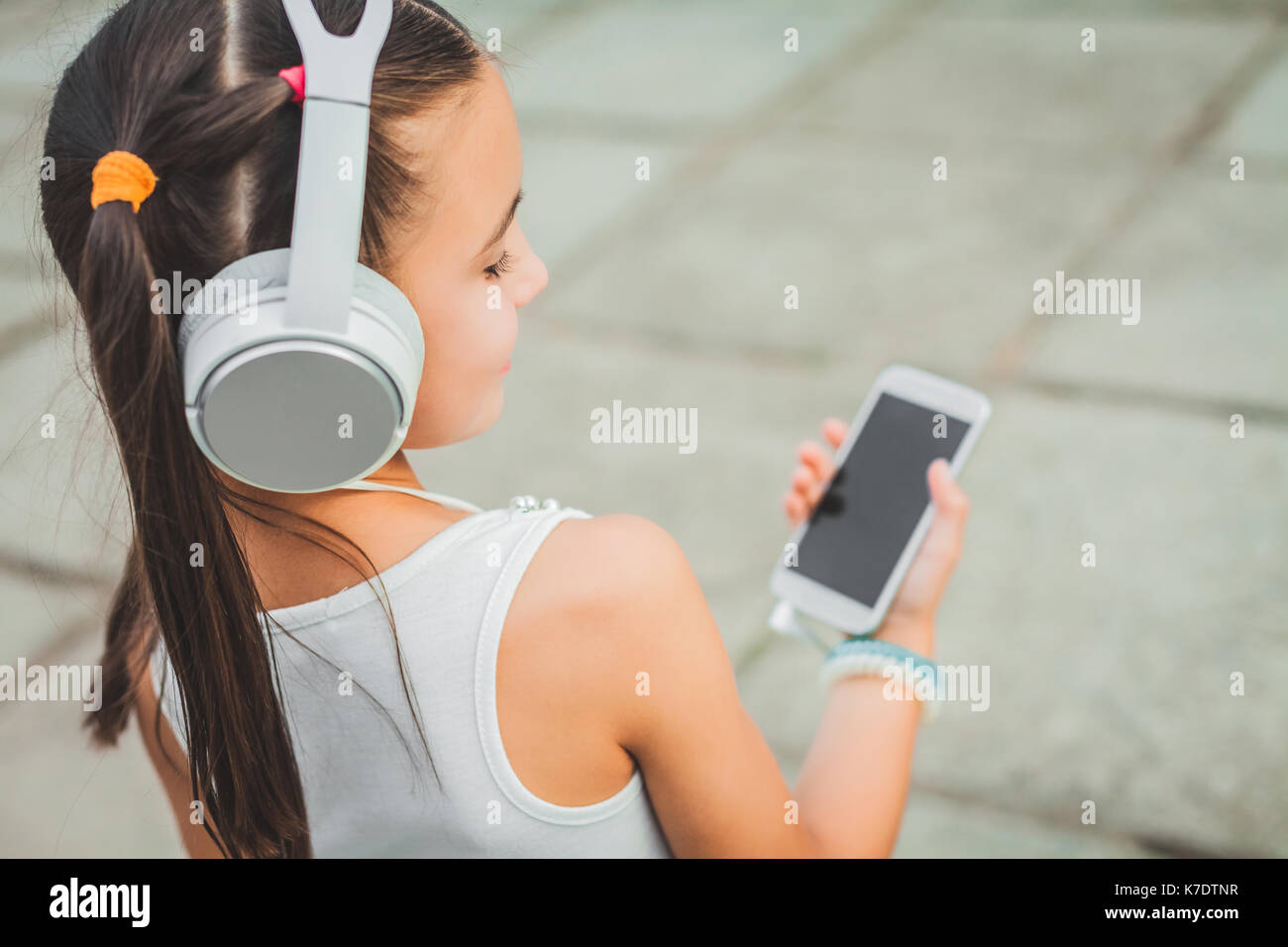 cute girl with white phone Stock Photo - Alamy