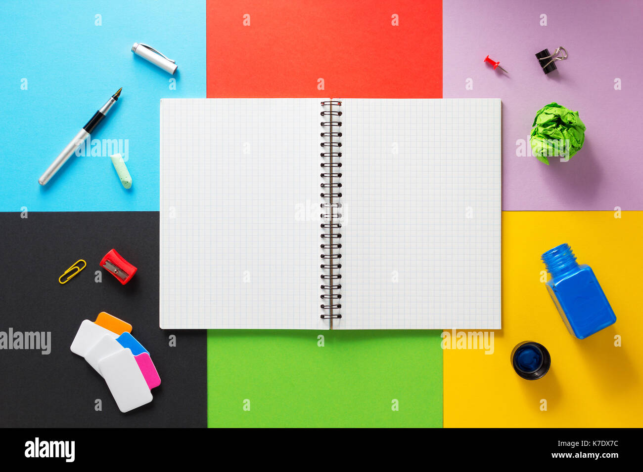 checked notebook at wooden background texture Stock Photo - Alamy