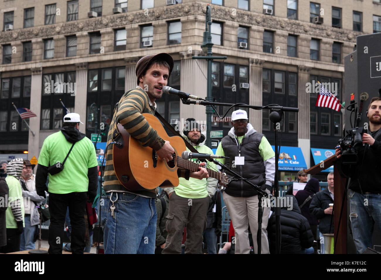 Musician and activist, Ryan Harvey, plays at a rally in Foley Square in ...