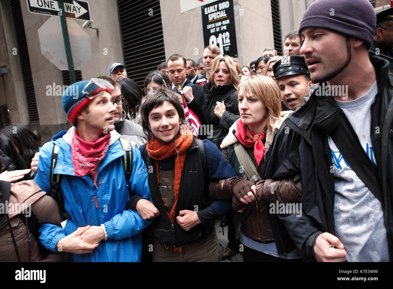 Protestors link arms to form a human chain during the Occupy Wall ...