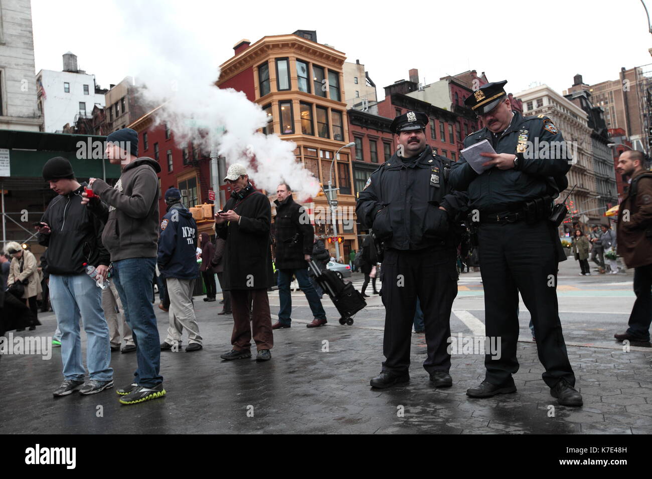 NYPD police officers stand watch over the Occupy Wall Street protest in ...