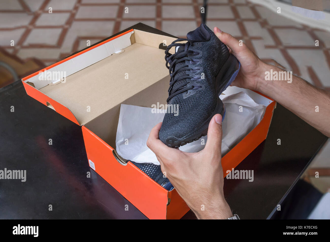 Opening a new pair of shoes. Hands opening the shipping box Stock Photo ...